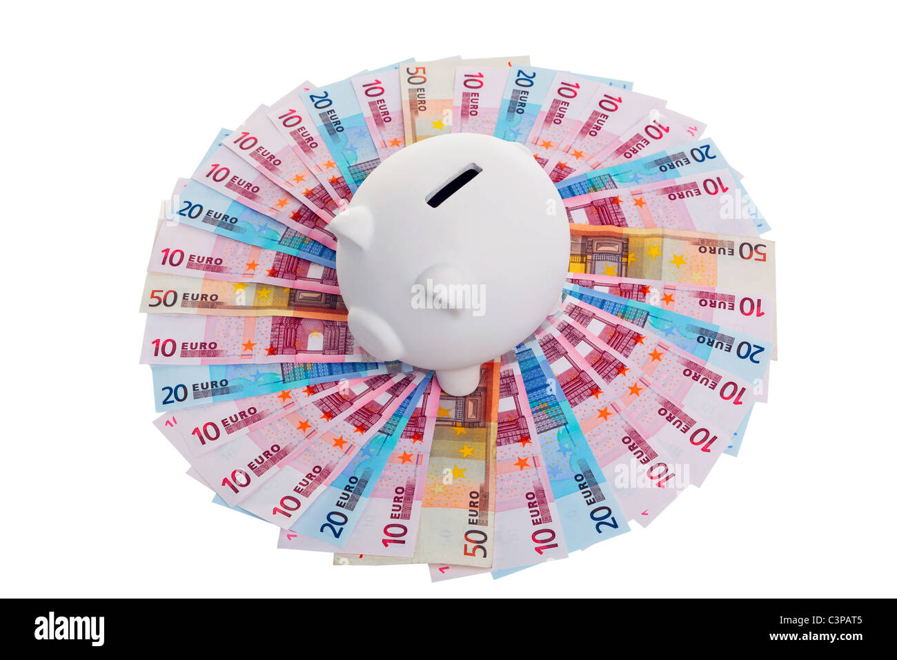 Photo of a piggy bank on a circle of Euro banknotes, cut out on a white ...