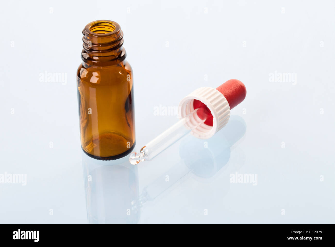Medicine bottle with a pipette Stock Photo - Alamy