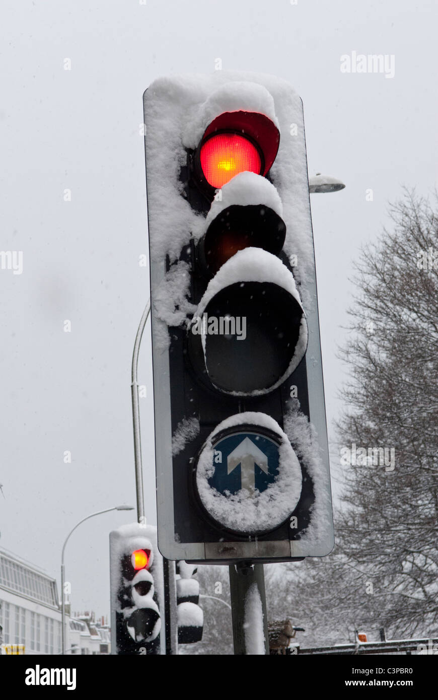 Red traffic light covered in snow Stock Photo - Alamy