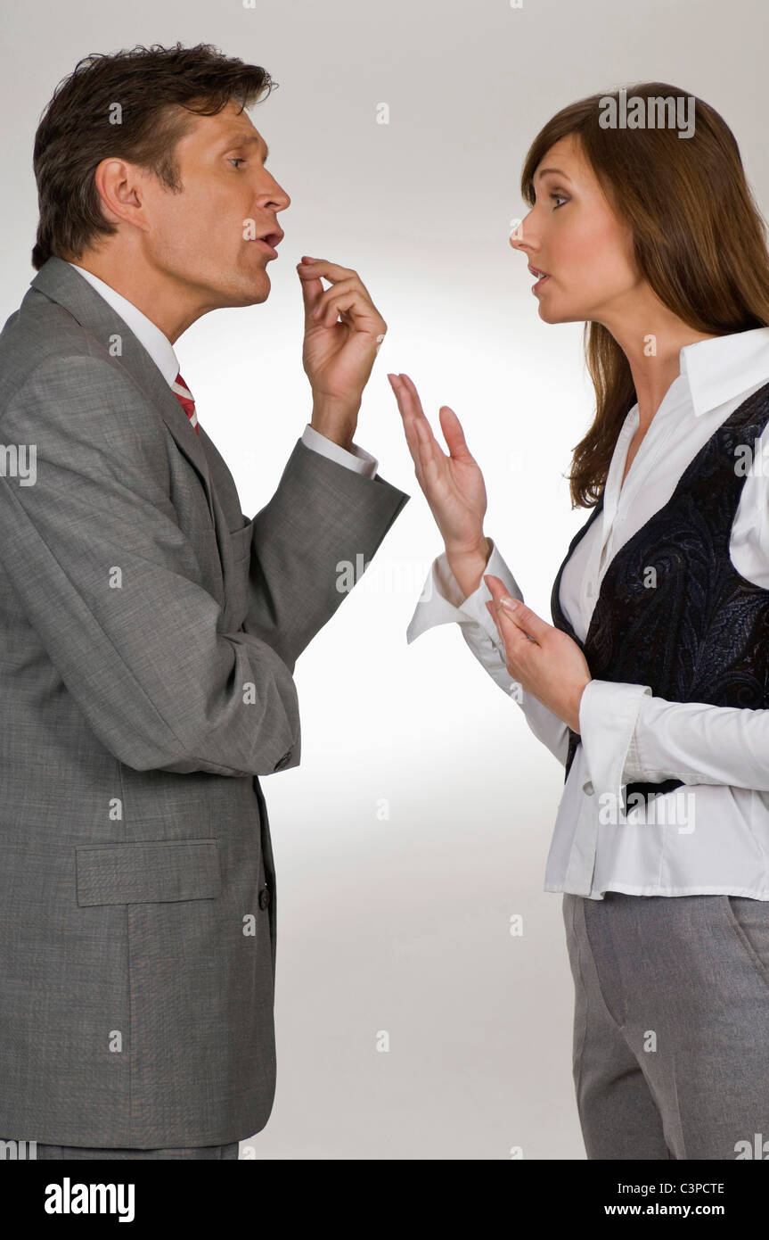 Businessman and Businesswoman talking, side view, portrait Stock Photo ...