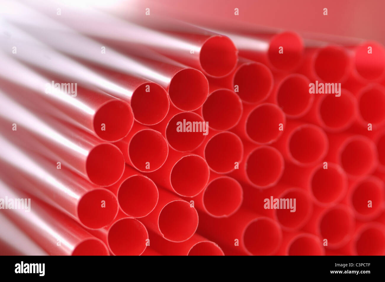 Bunch of red drinking straws, close up Stock Photo - Alamy