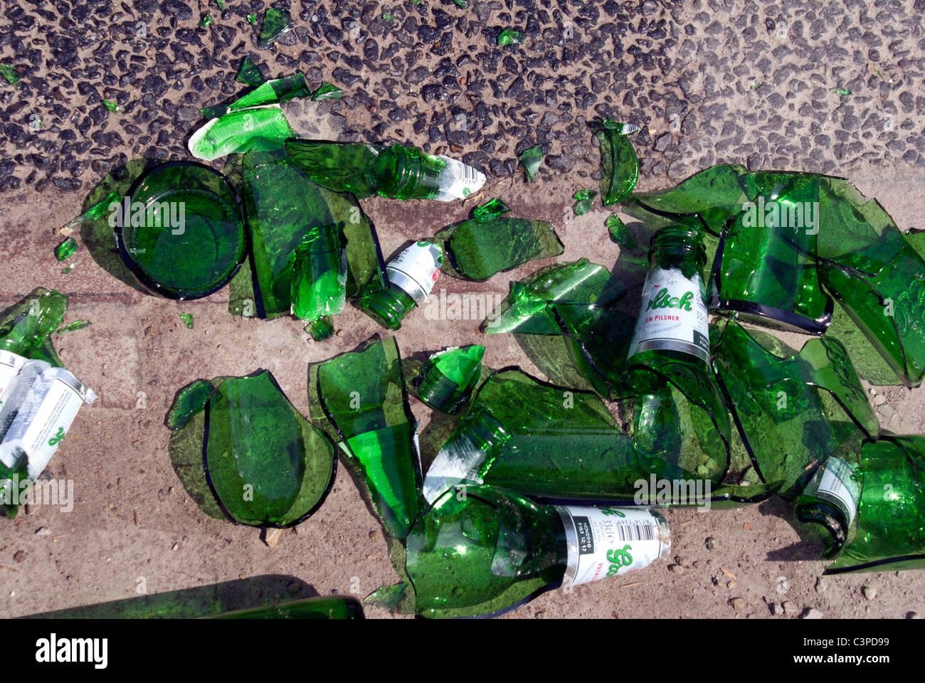 Broken green beer bottles on a pavement in Amsterdam Stock Photo - Alamy