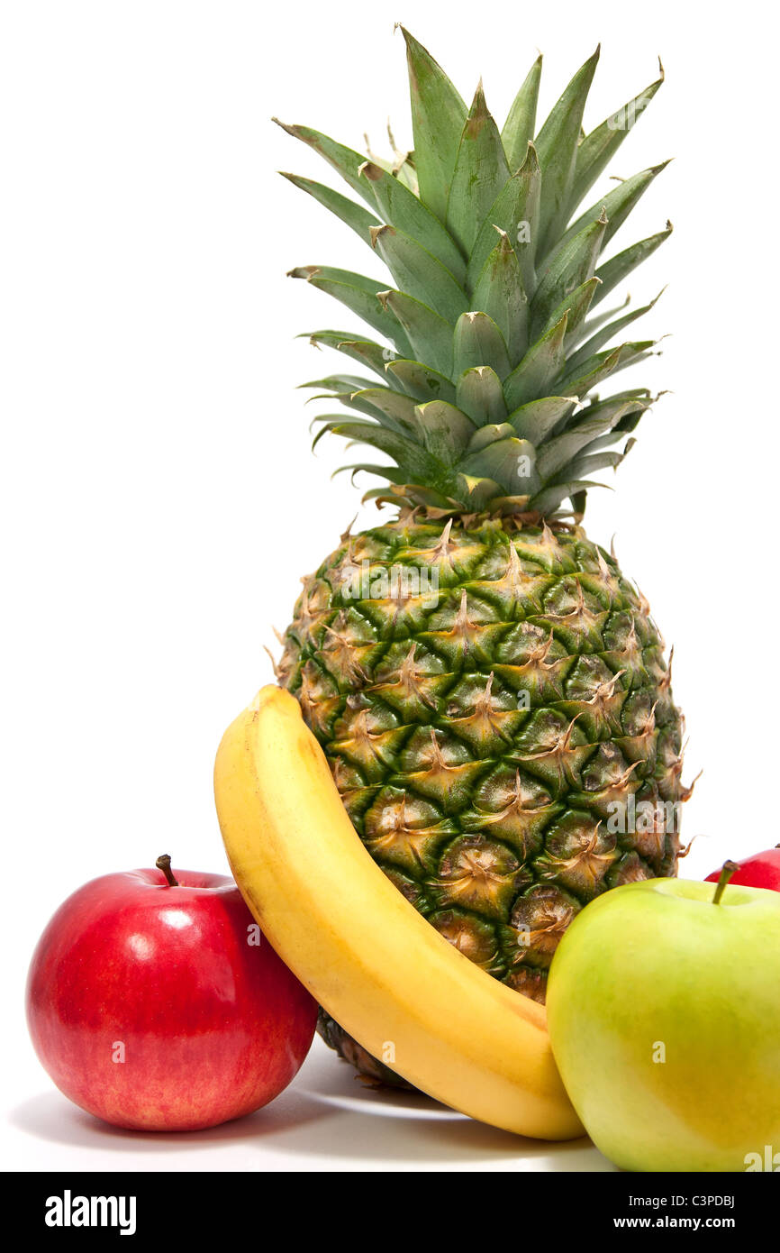 Pineapple, banana and apples on white background Stock Photo - Alamy