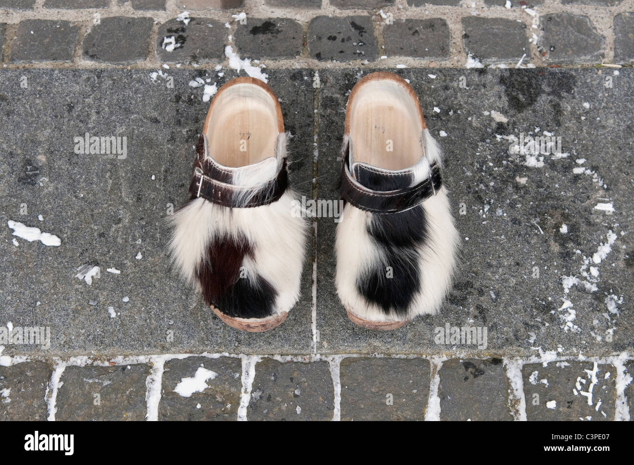 Pair of wooden shoes with cowskin on pavement Stock Photo - Alamy