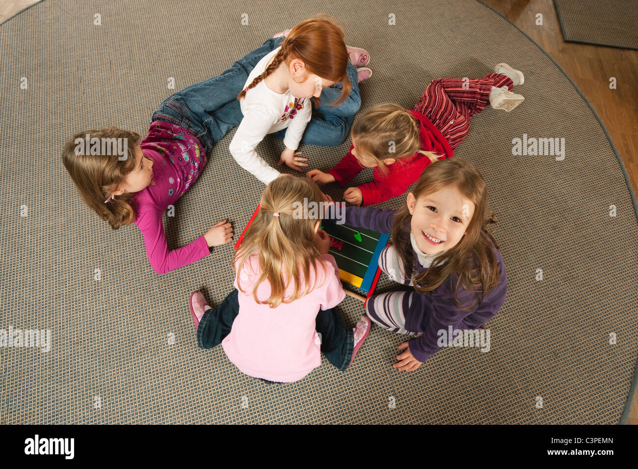 Germany, Children in nursery playing together, elevated view Stock ...