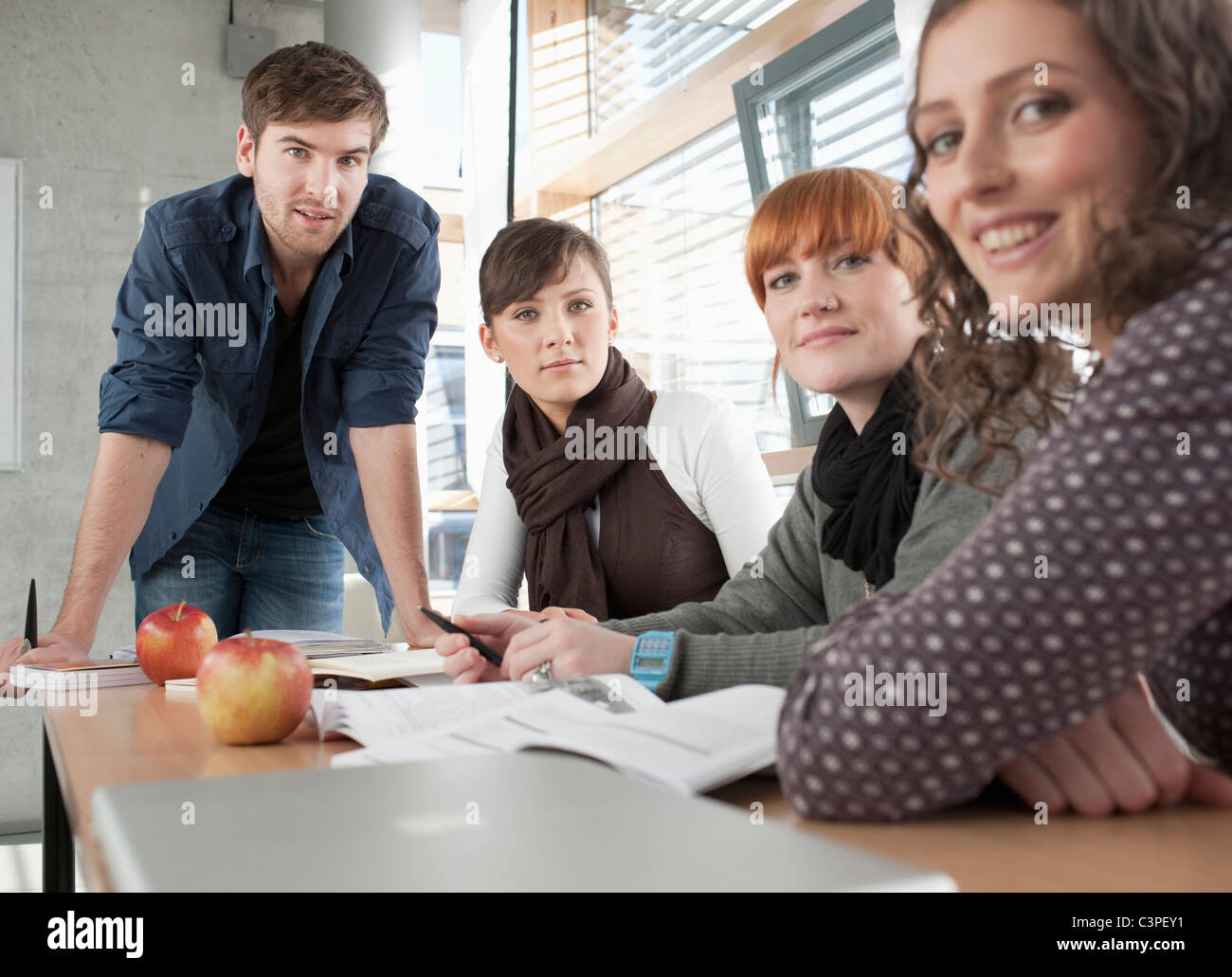 Germany, Leipzig, University students studying together, smiling ...