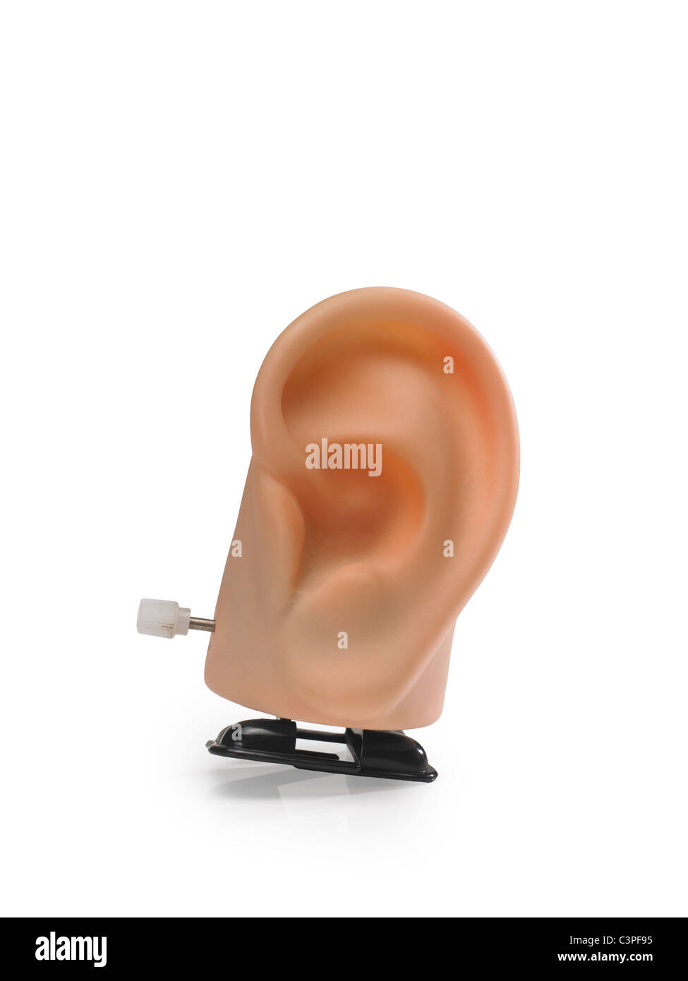 walking wind up toy human ear cut out on white Stock Photo - Alamy