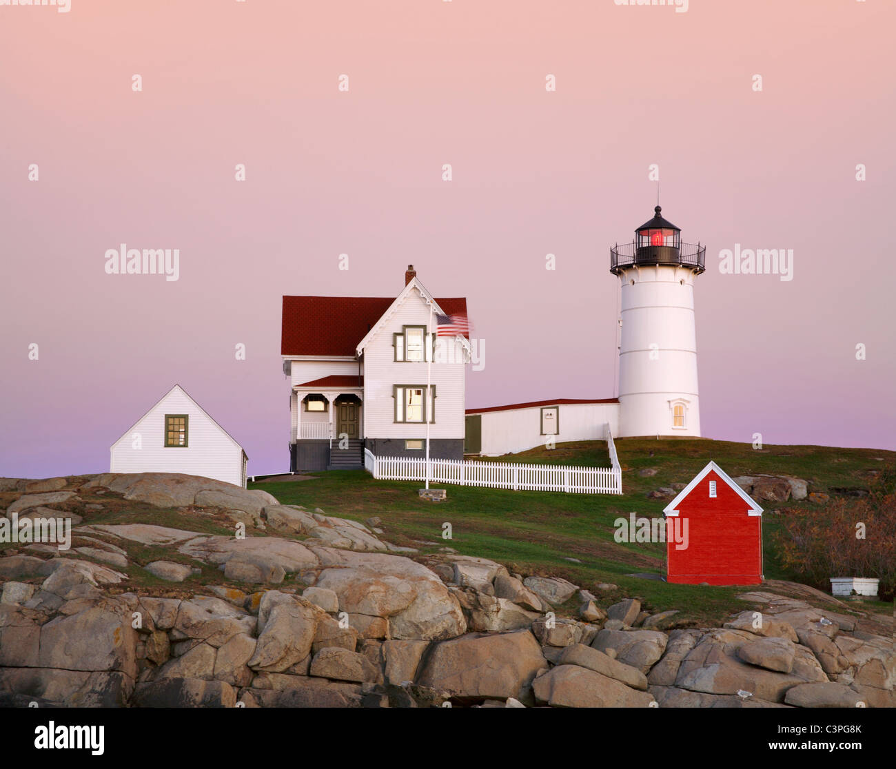 A Classic New England Lighthouse, The Nubble Light Glowing In Soft ...