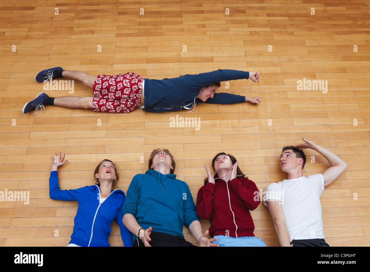 Teenage boy flying over friends hi-res stock photography and images - Alamy
