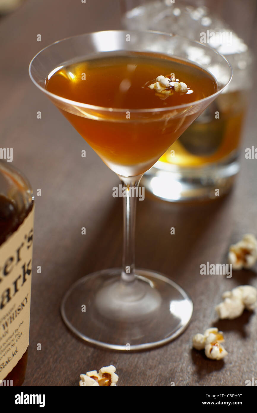 Martini glass with martini and popcorn, close up Stock Photo - Alamy