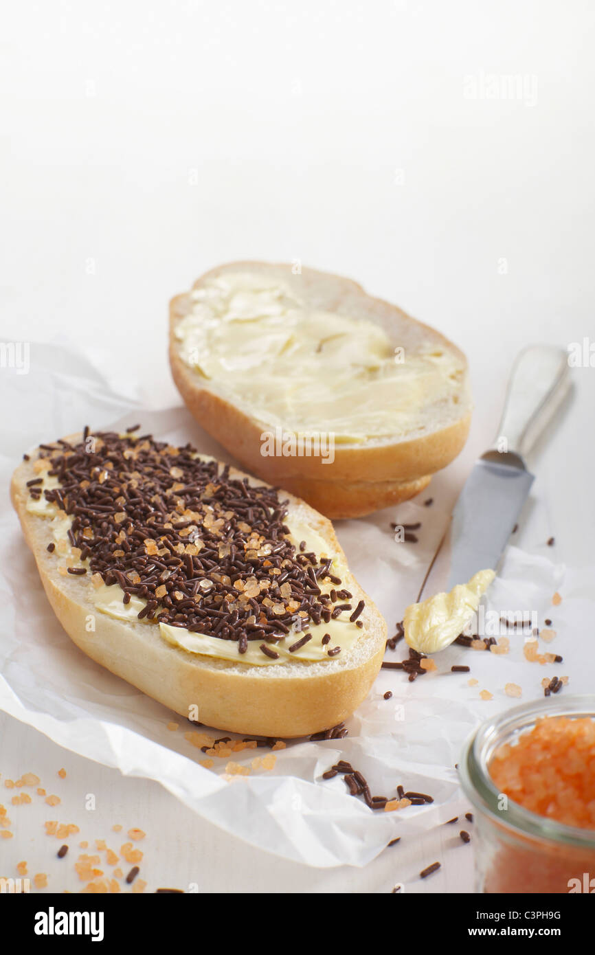 Bread slice topped with butter, sugar and chocolate sprinkles Stock ...