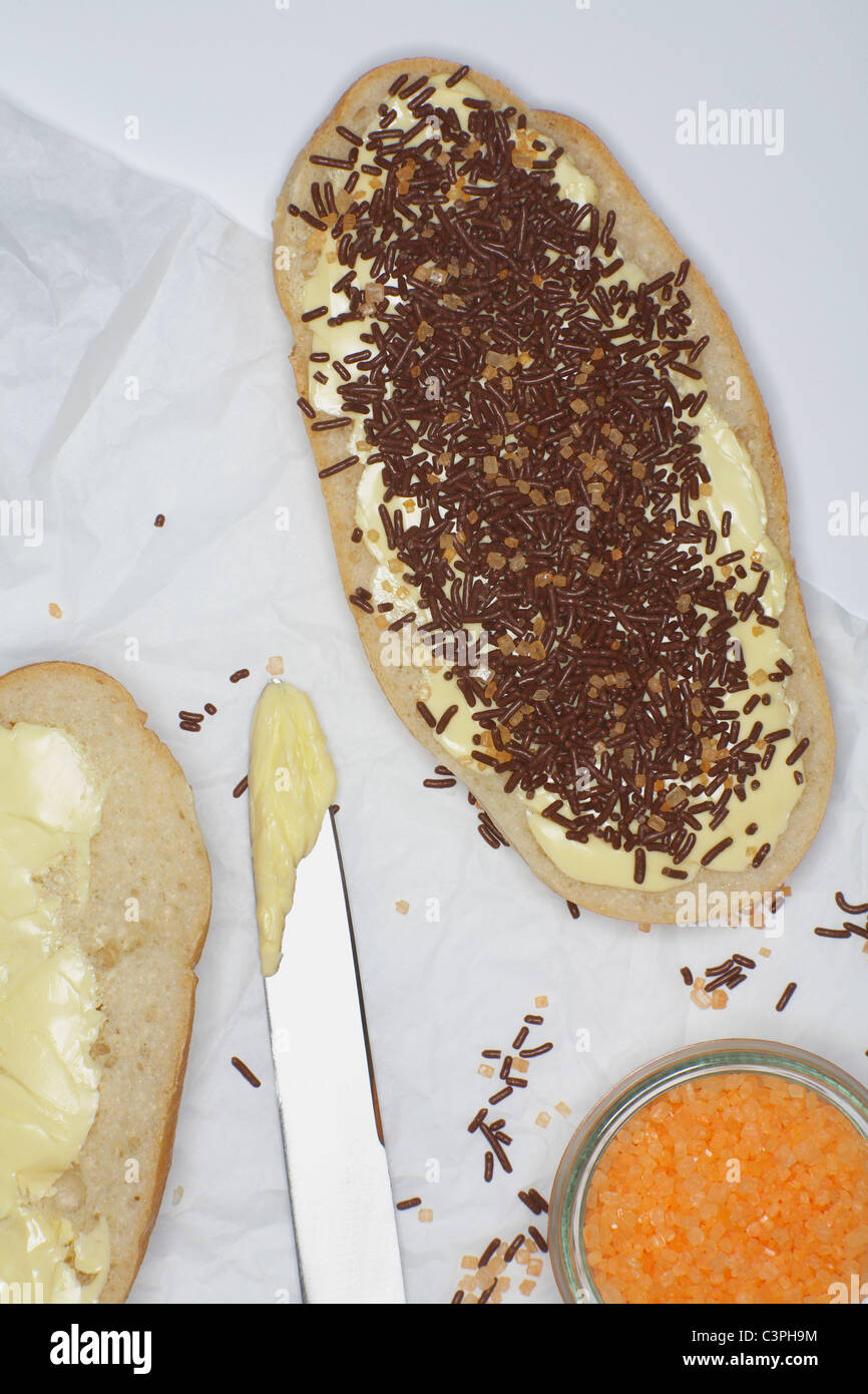 Bread slice topped with butter, sugar and chocolate sprinkles Stock ...