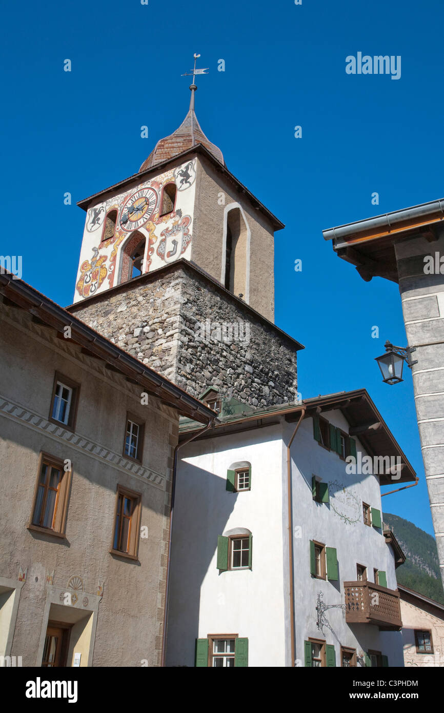 Switzerland, Grisons, Engadin, Village of Guarda with chuch and steeple ...