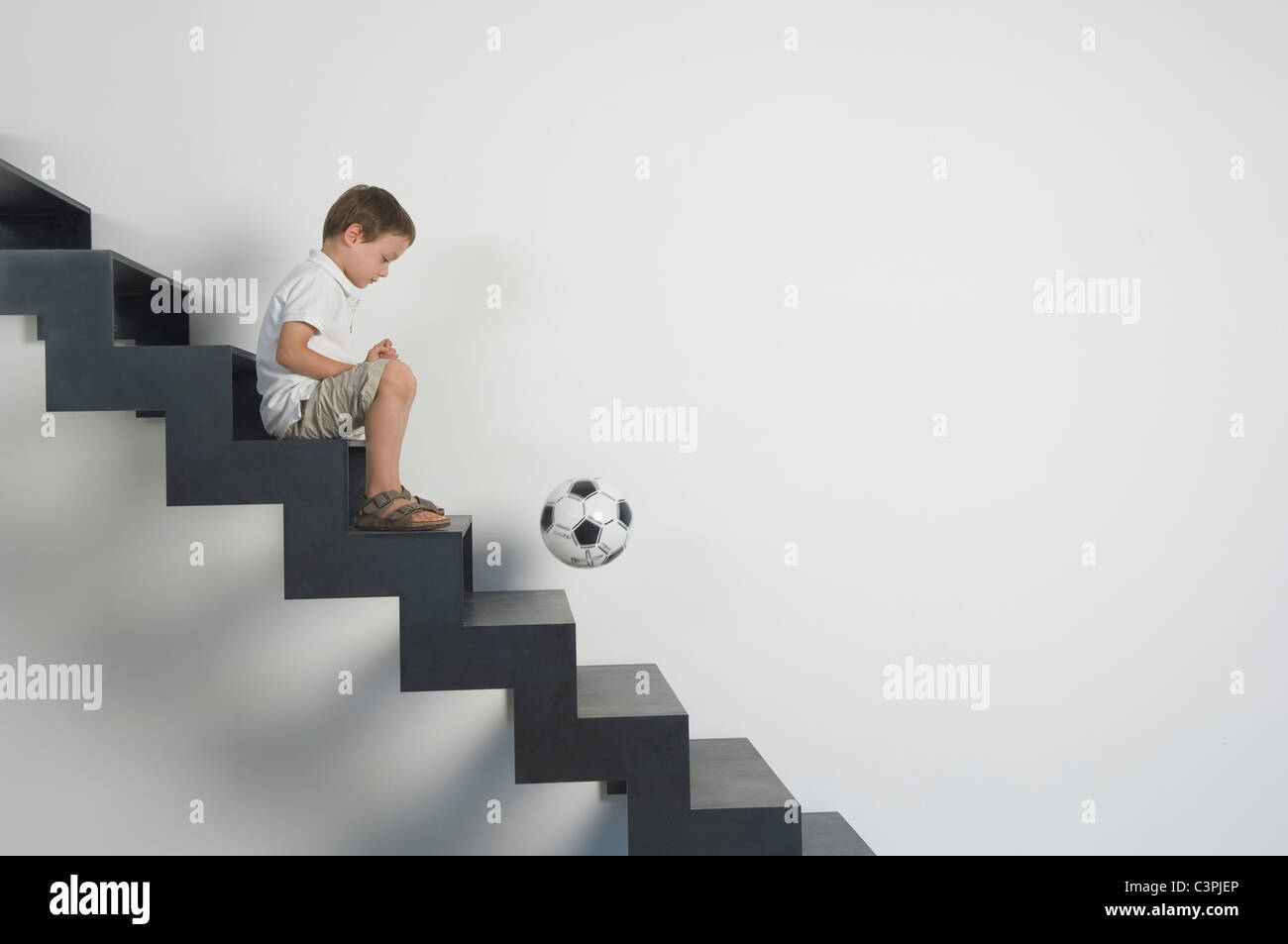 Full length sitting down football hi-res stock photography and images ...