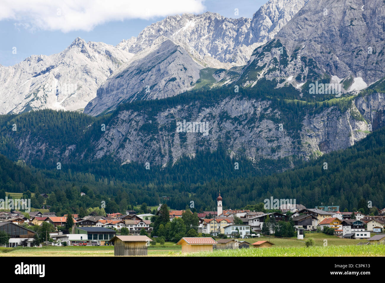 Austria, Tyrol, Mieming, Ehrwald, View of village with mountain ranges ...