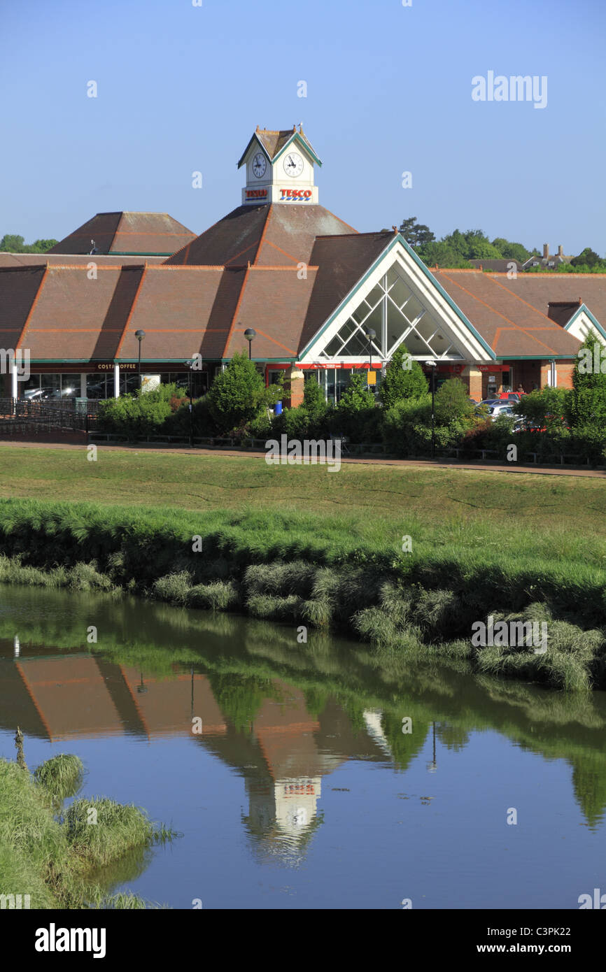 A Tesco Superstore reflected in the River Ouse, Lewes, East Sussex ...