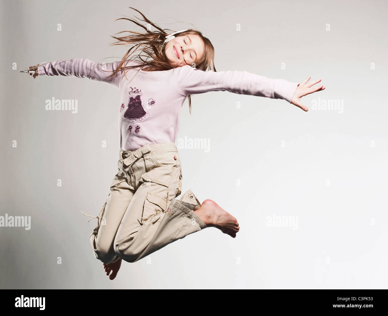 Child girl jumping cheering hi-res stock photography and images - Alamy