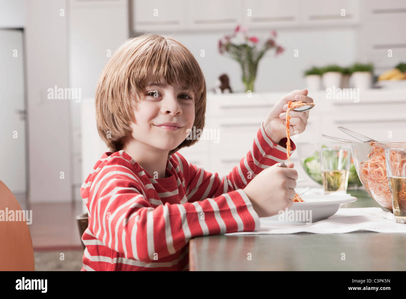 Germany, Cologne, Boy (6-7) eating Spaghetti, portrait, close-up Stock ...