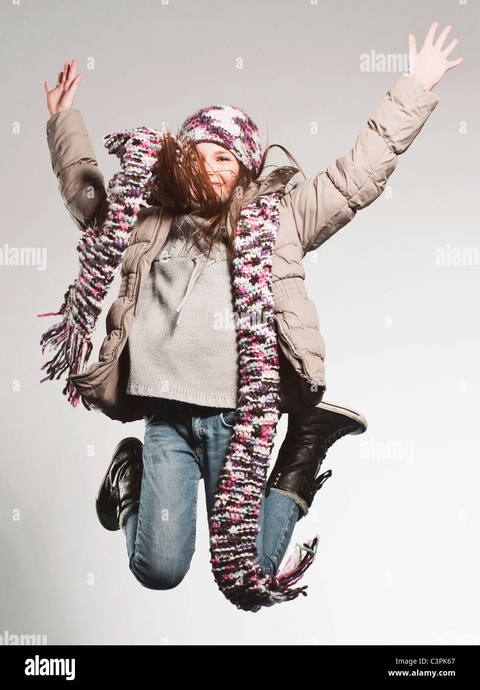 Girl 8 9 jumping with arms up hi-res stock photography and images - Alamy