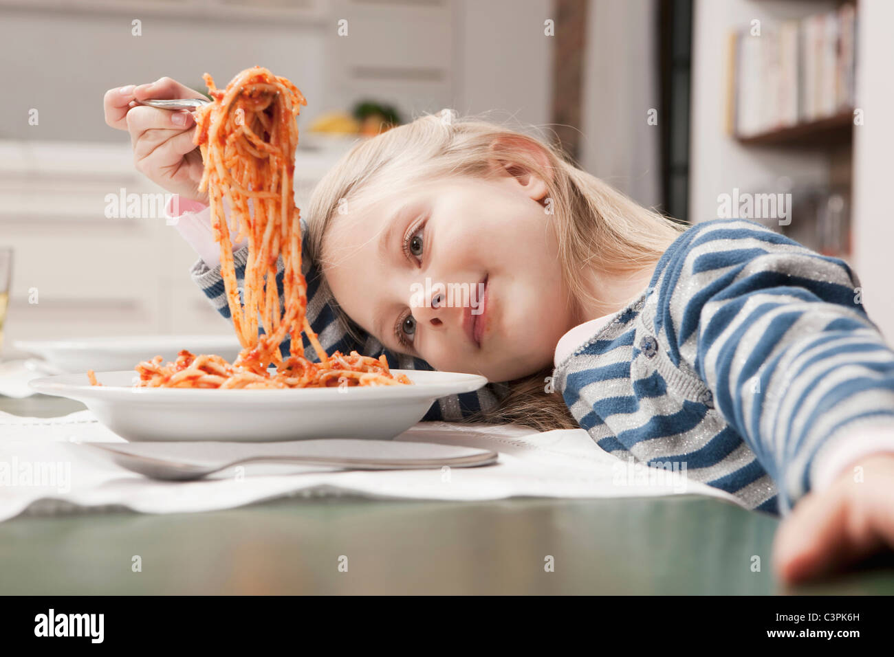 Girl resting head on table hi-res stock photography and images - Alamy