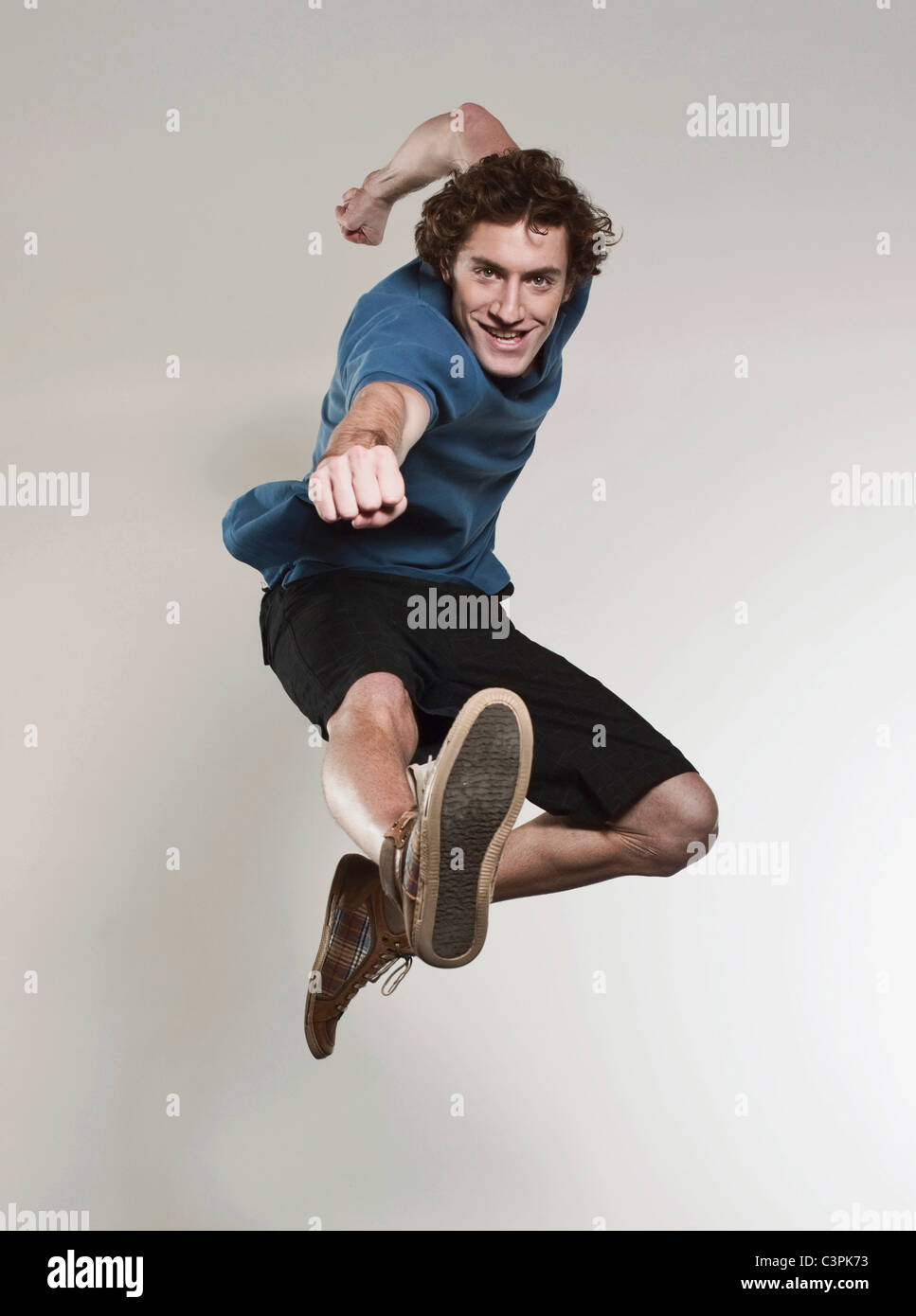 Man jumping and punching in air hi-res stock photography and images - Alamy