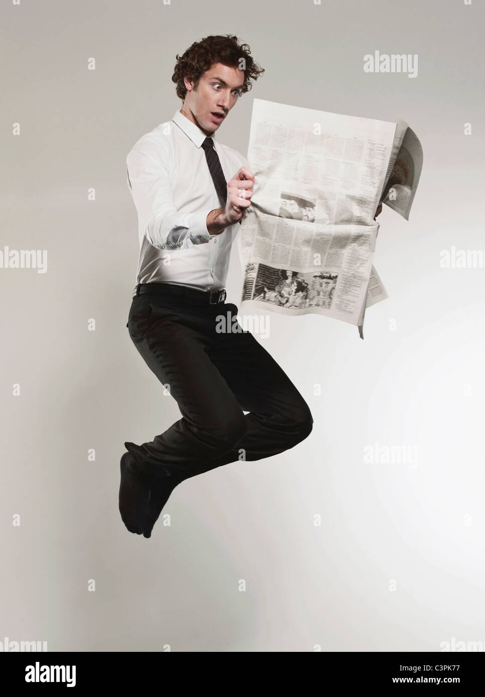 Newspaper surprise shock reading news hi-res stock photography and ...