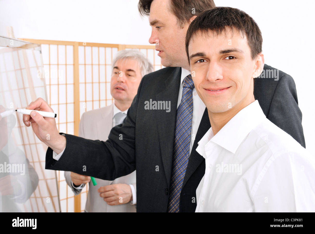 Portrait of a team planning. Office background Stock Photo - Alamy
