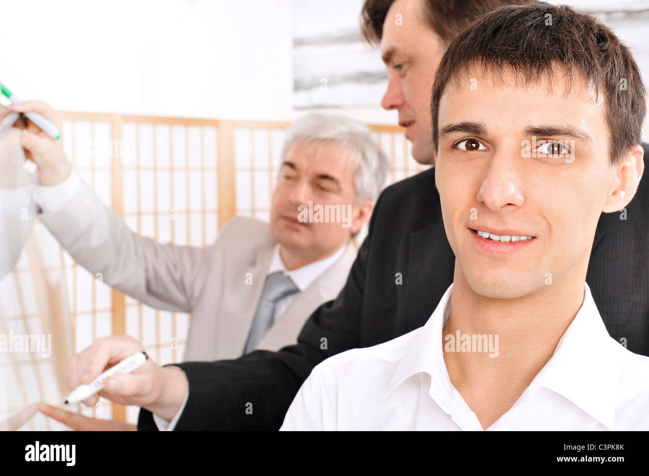 Portrait of a team planning. Office background Stock Photo - Alamy