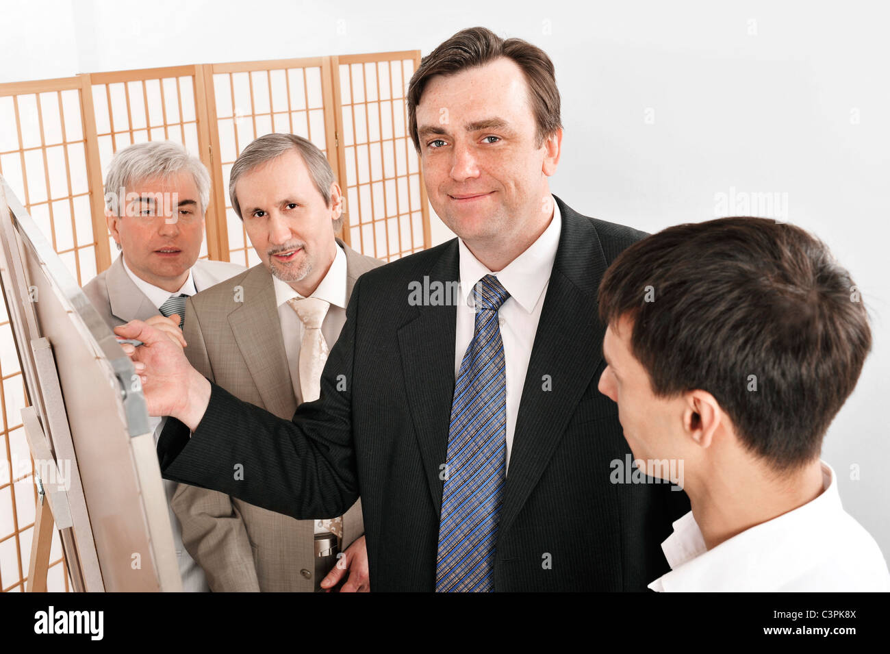 Portrait of a team planning. Office background Stock Photo - Alamy