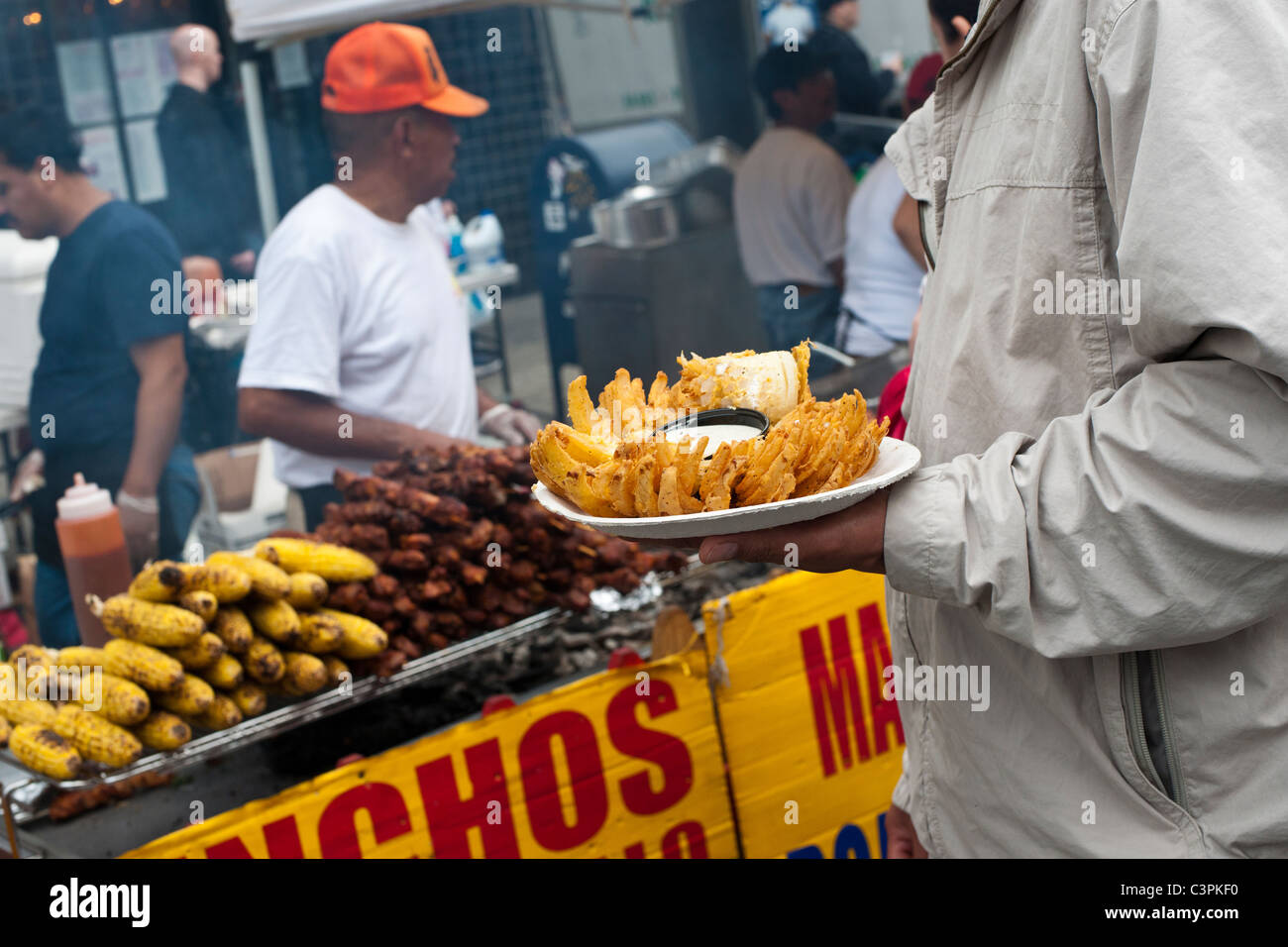 A stand selling ethnic food at the Ninth Avenue Food Festival in New ...