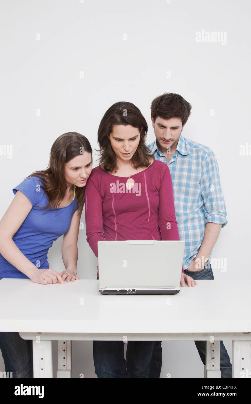 Man and women using laptop Stock Photo - Alamy