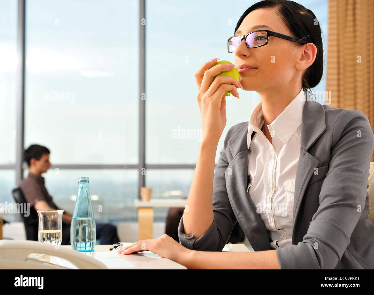 Portrait of a beautiful young businesswoman thinking. Office background ...