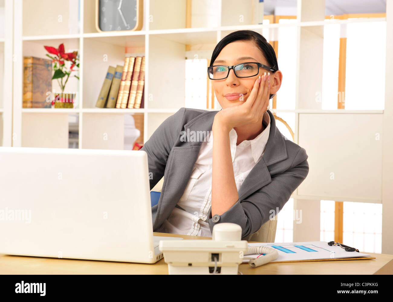 Portrait of a beautiful young businesswoman thinking. Office background ...