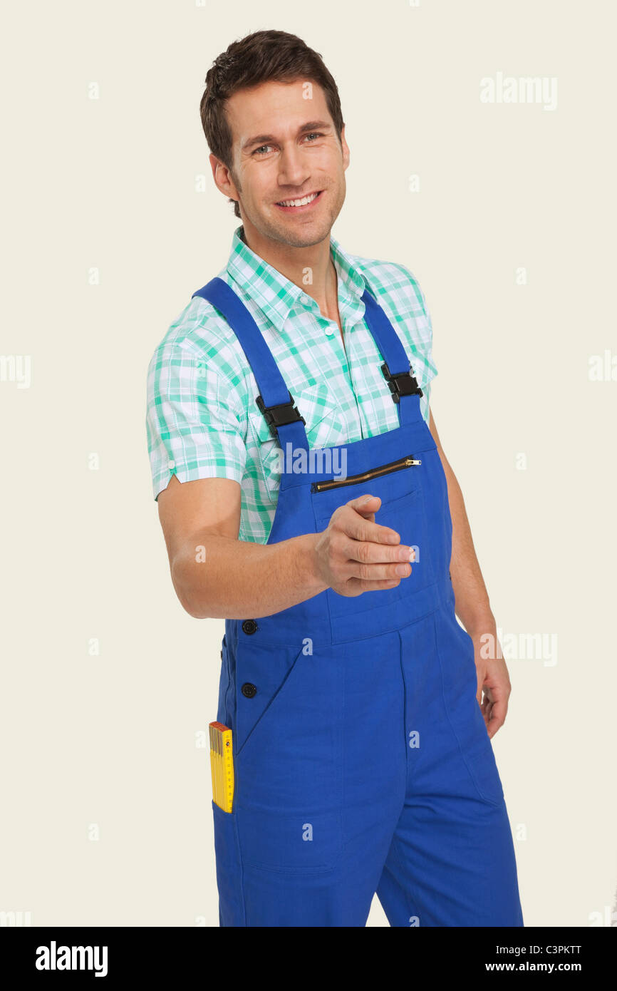Man in overall smiling, portrait Stock Photo - Alamy