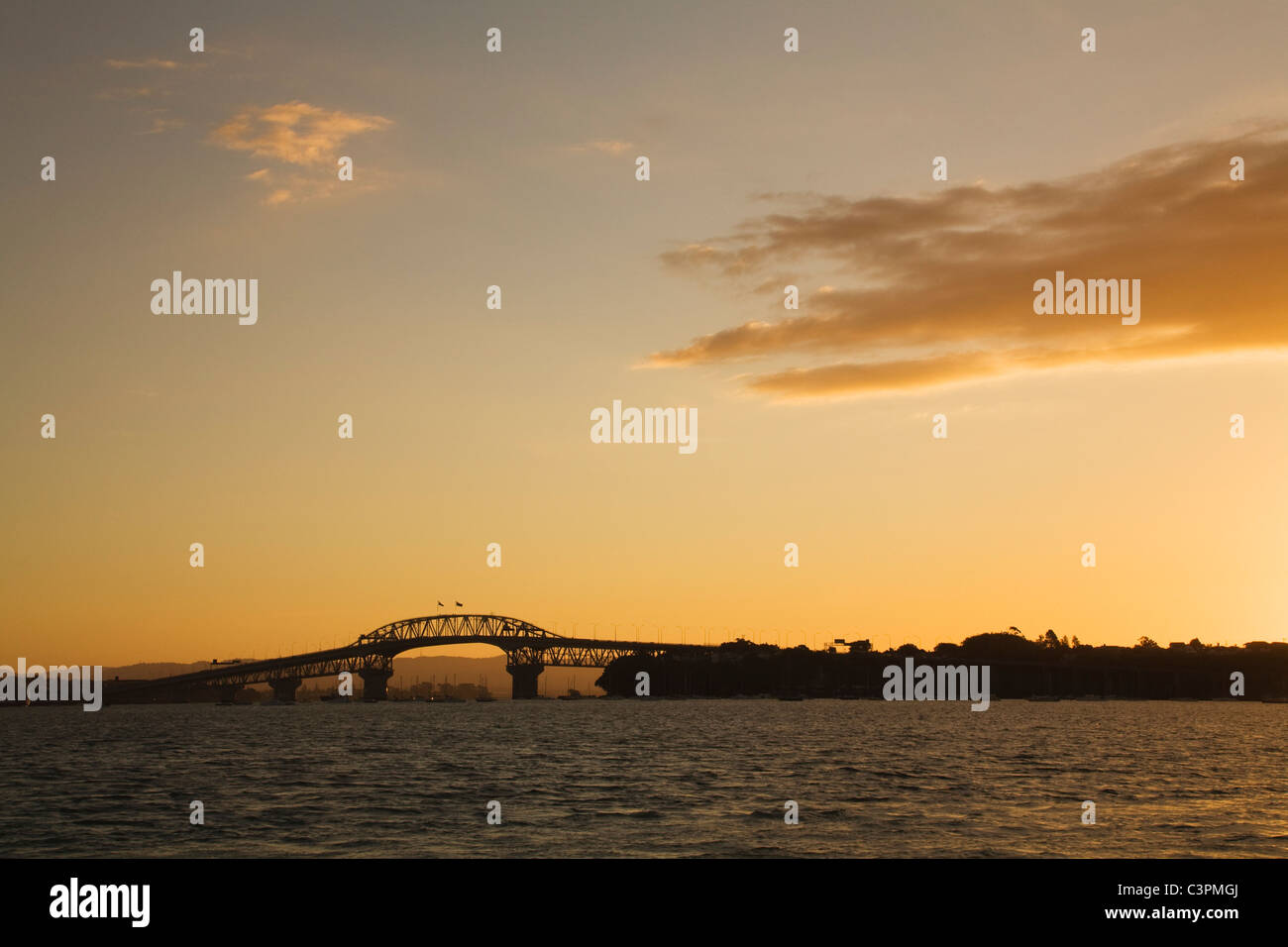 New Zealand, Auckland, North Island, View of harbour bridge at sunset ...