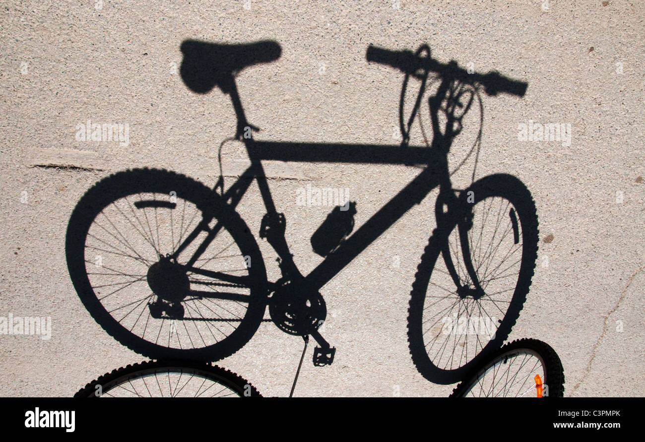 Bicycle shadow on a pavement Stock Photo - Alamy