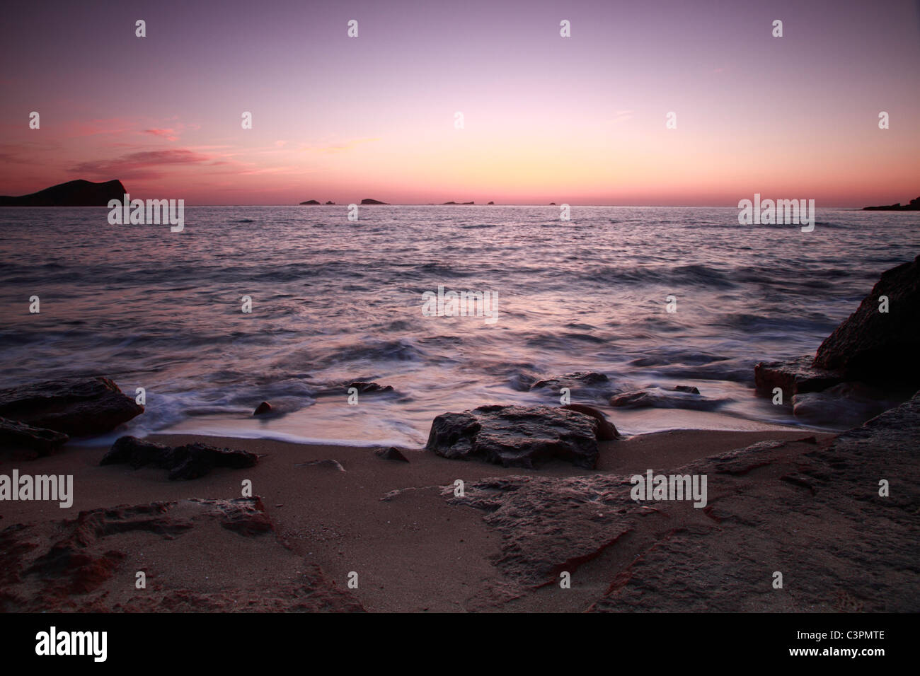 Beach of Cala Conta at sunset, Ibiza, Spain Stock Photo - Alamy