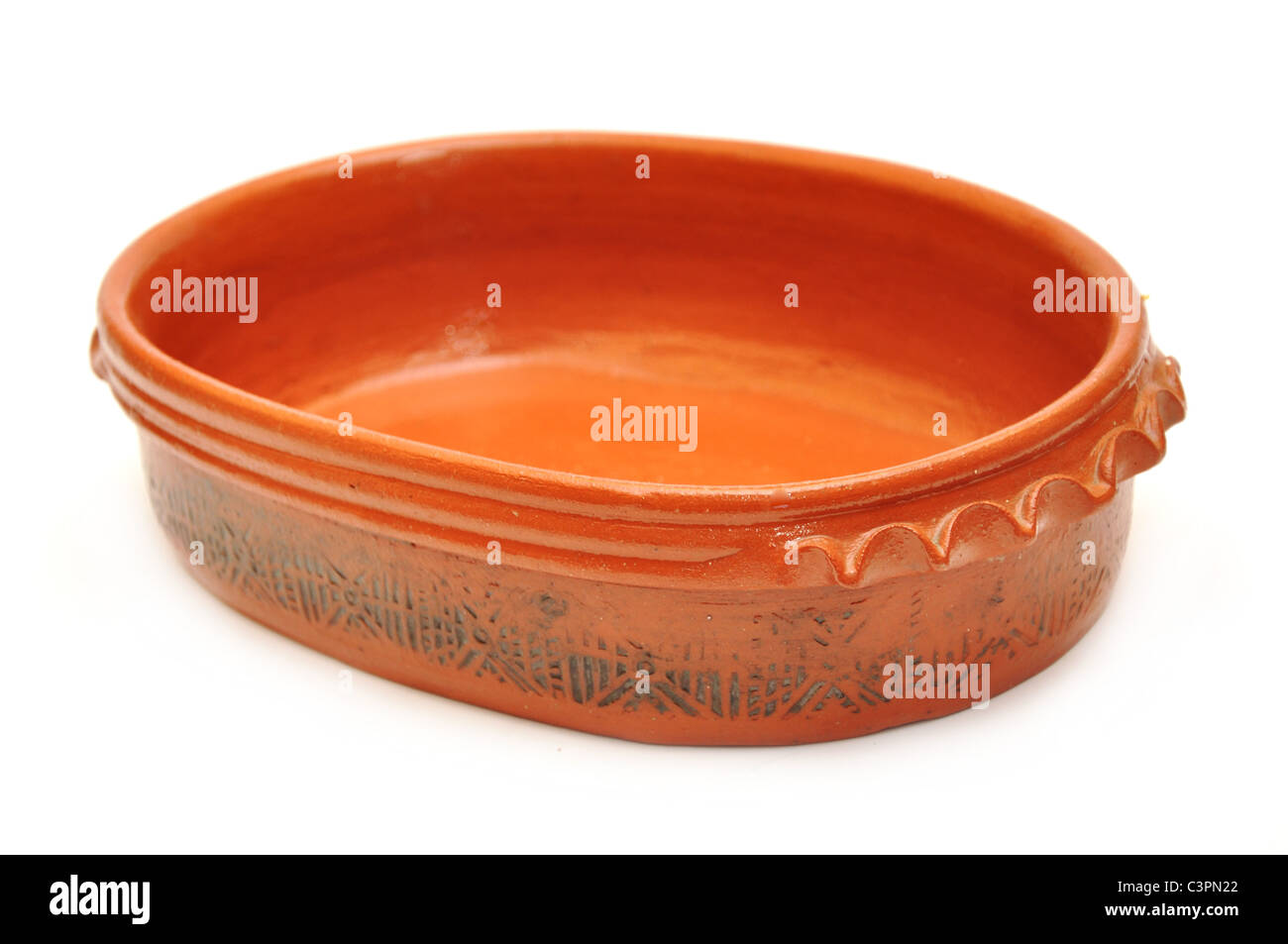 old clay ceramic pot, shaped rounder at the bottom, and more narrow at ...