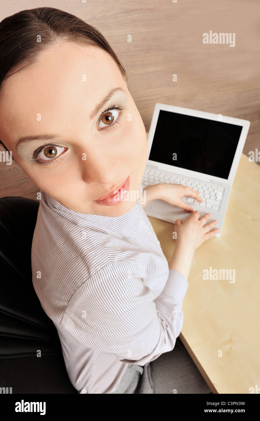 Portrait of a beautiful young businesswoman looking at the camera ...