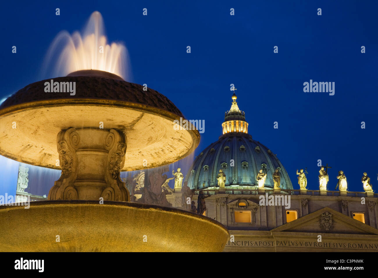 Italy, Rome, Vatican, Close up of fountain with St Peter's Basilica in ...