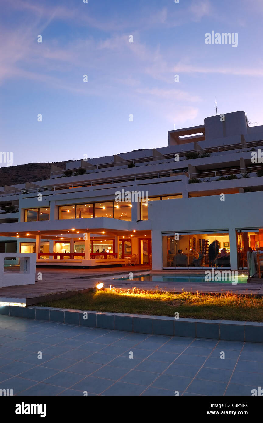 Restaurant's illumination of luxury hotel during sunset, Crete, Greece ...