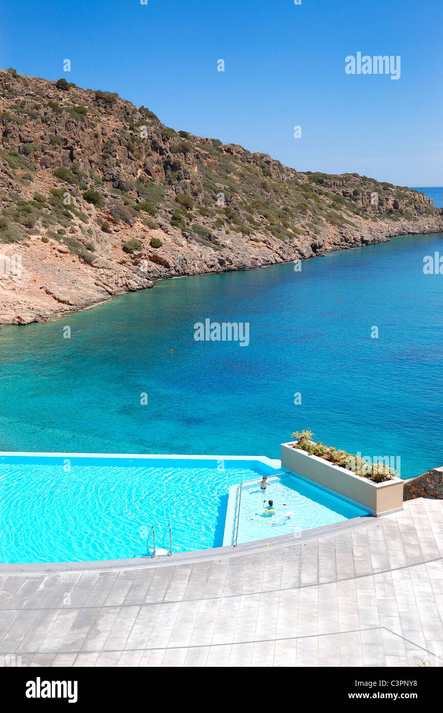 Swimming pool and beach at the luxury hotel, Crete, Greece Stock Photo ...