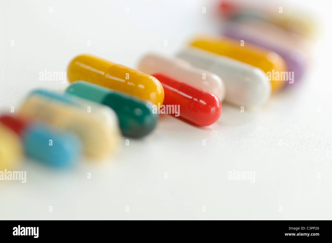 Variety of pills on white background Stock Photo - Alamy