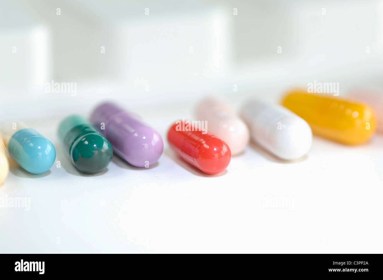 Variety of pills on white background Stock Photo - Alamy