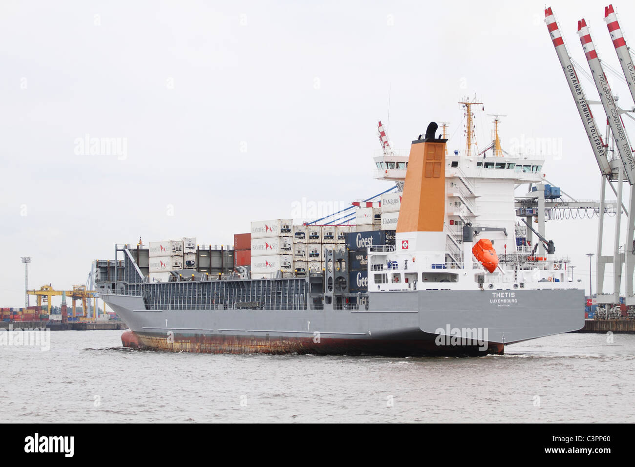 Container ship at the river elbe hi-res stock photography and images ...