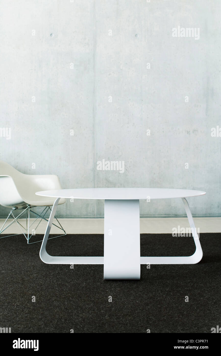 Switzerland, Wintertur, Designer table and chair in living room Stock ...