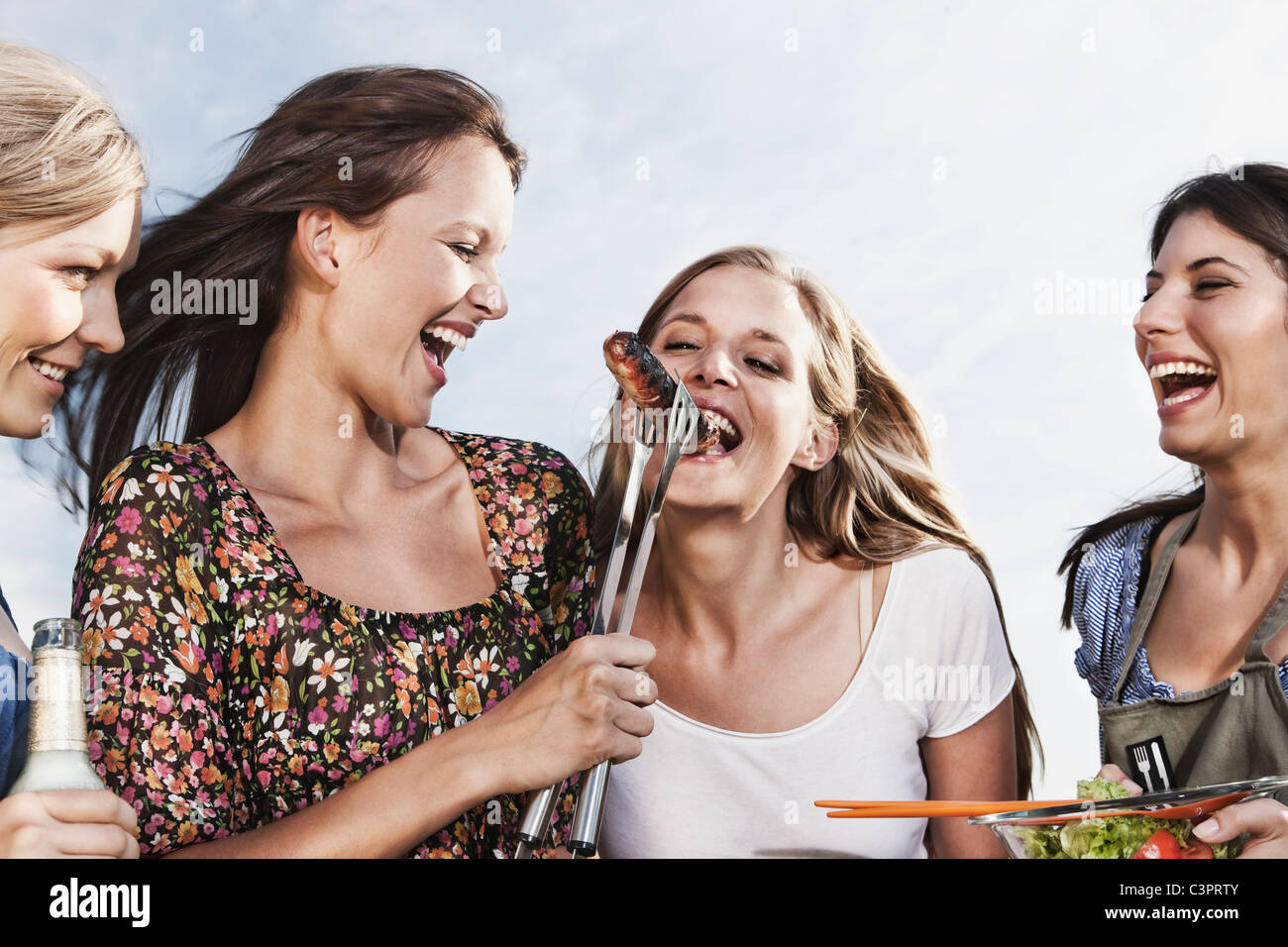 Germany, Cologne, Women enjoying beer and sausages Stock Photo - Alamy