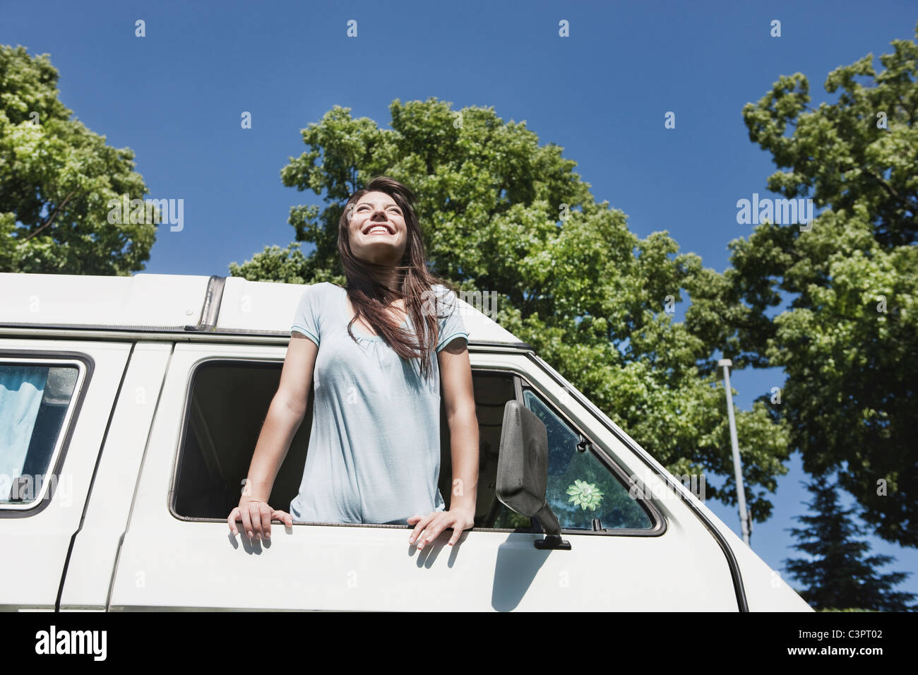 Germany, Cologne, Young woman smiling Stock Photo - Alamy