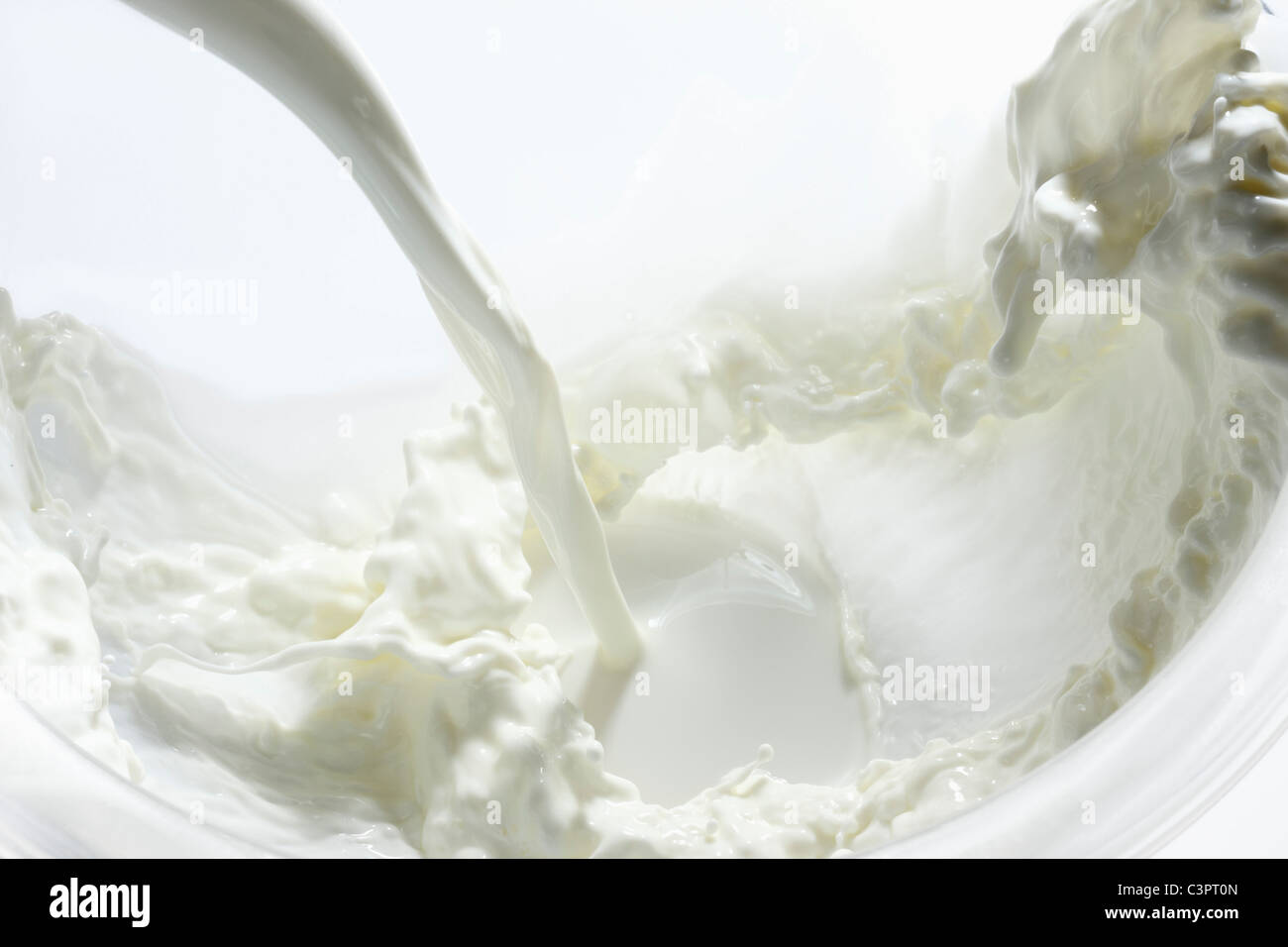 Close up of splashing milk Stock Photo - Alamy