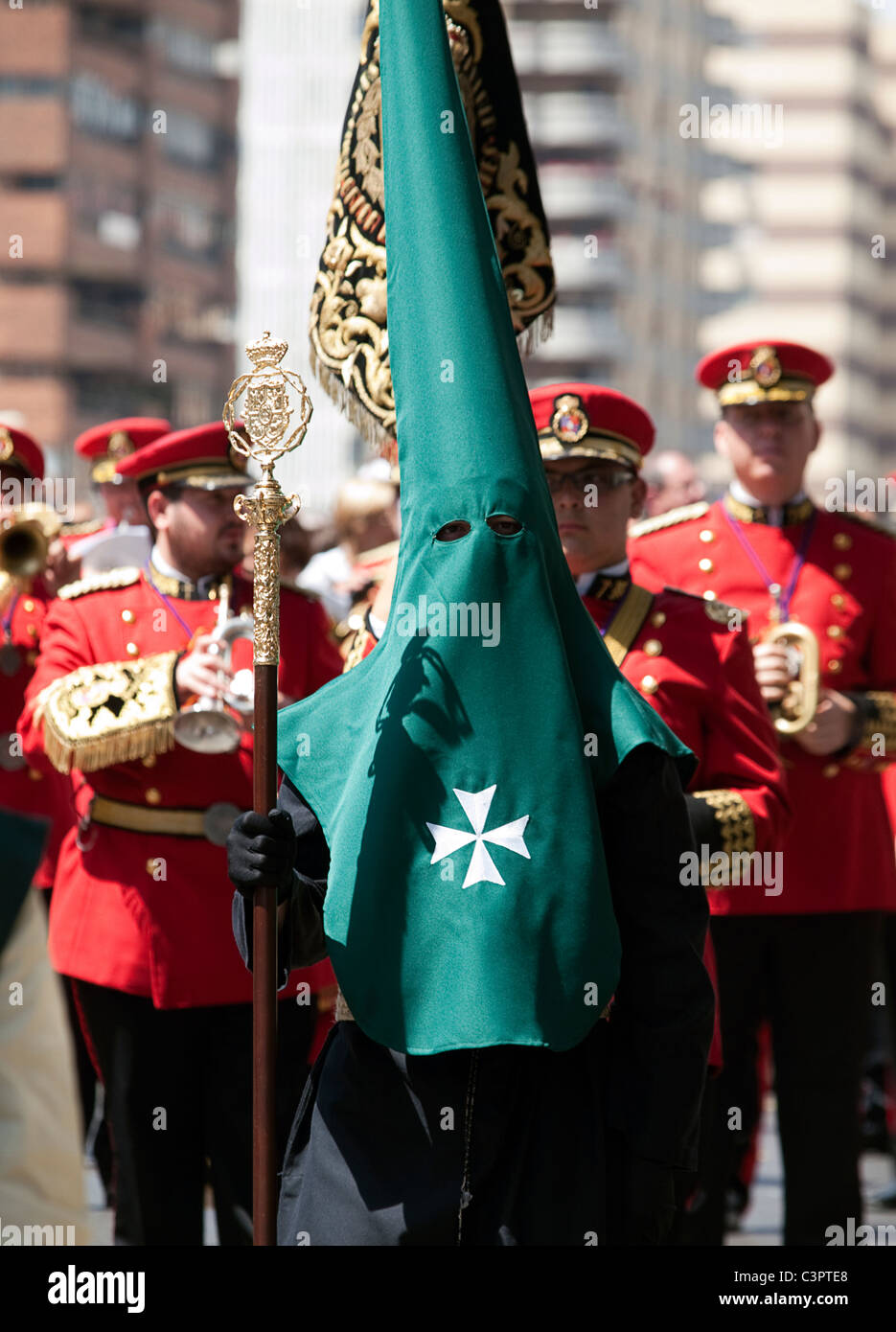 A Nazareno in procession during Semana Santa in Malaga, Spain, April ...